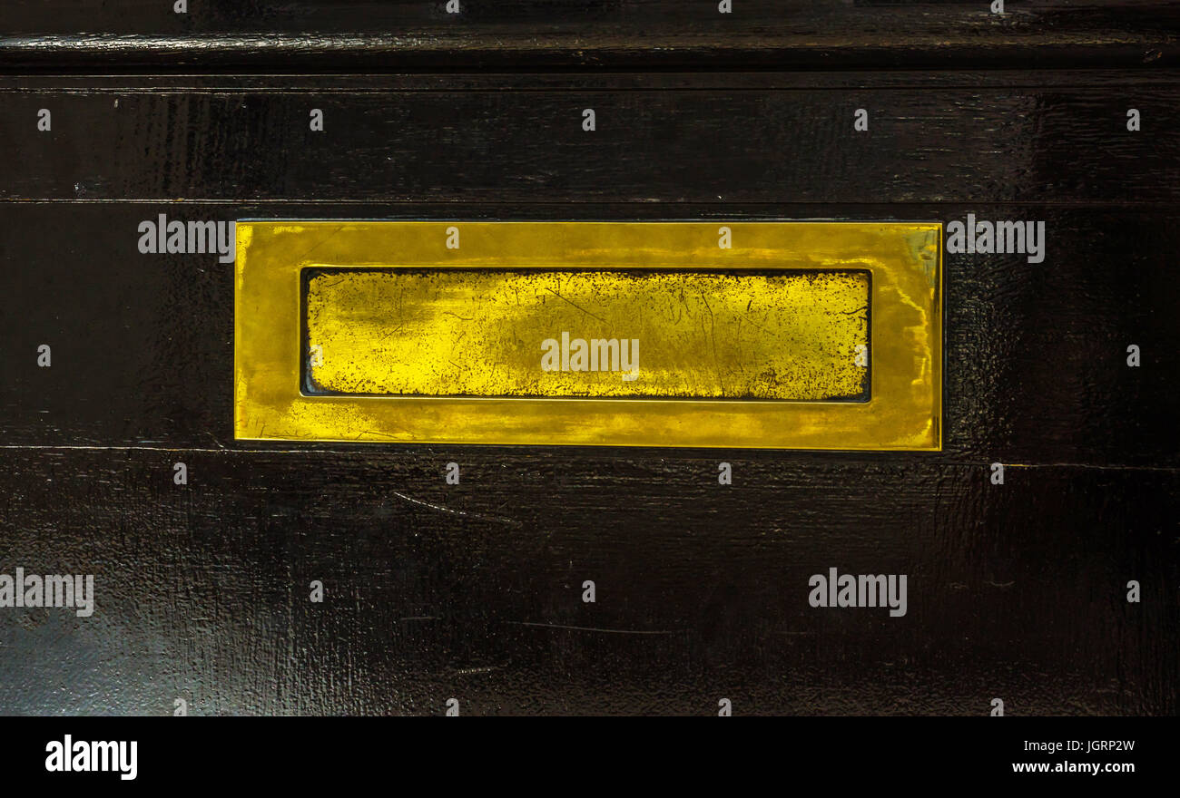 Old letterbox in the door, traditional way of delivering letters to the ...