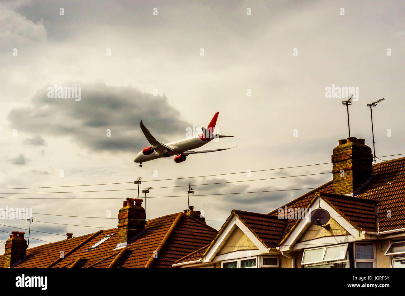 Passenger plane flying in the blue sky with clouds, cruise aircraft ...