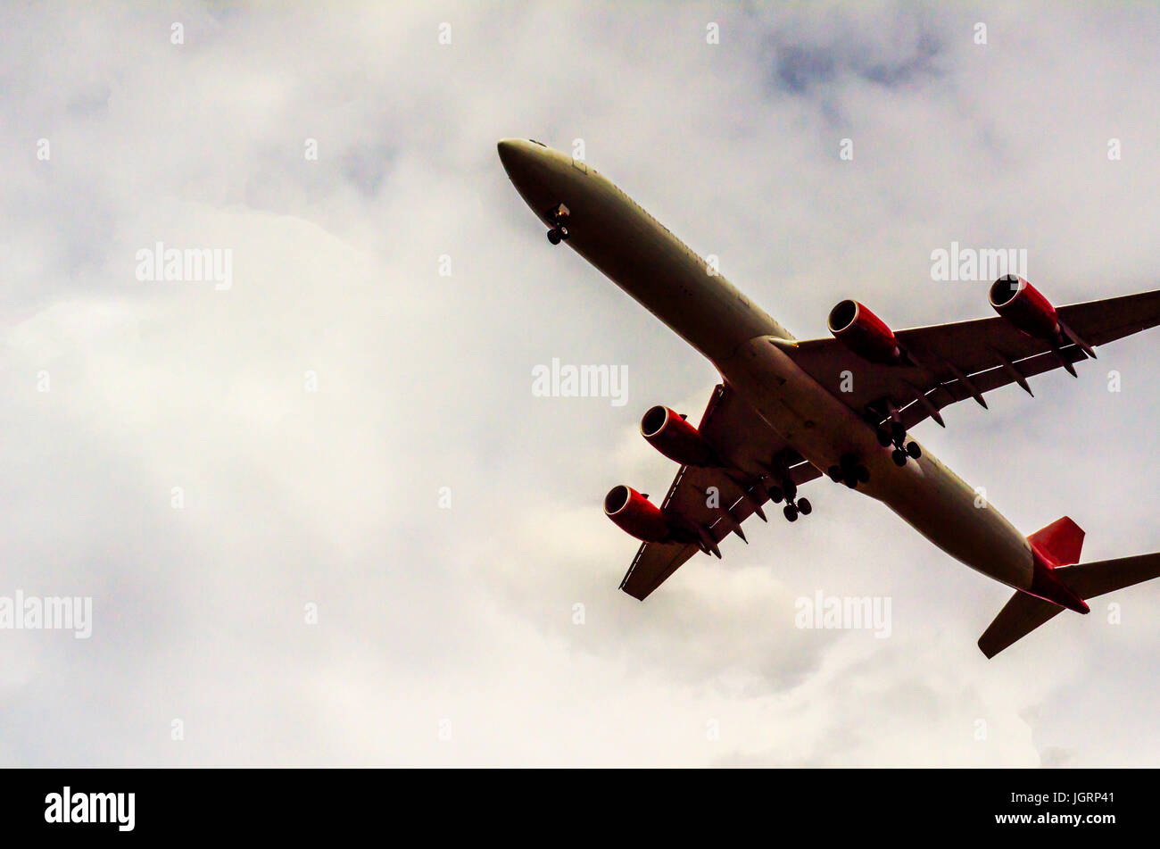 Passenger plane flying in the blue sky with clouds, cruise aircraft ...