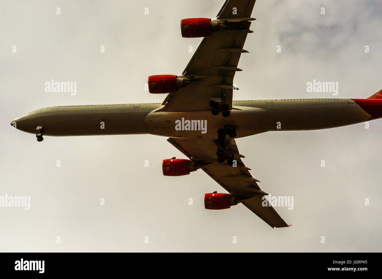 Passenger plane flying in the blue sky with clouds, cruise aircraft ...