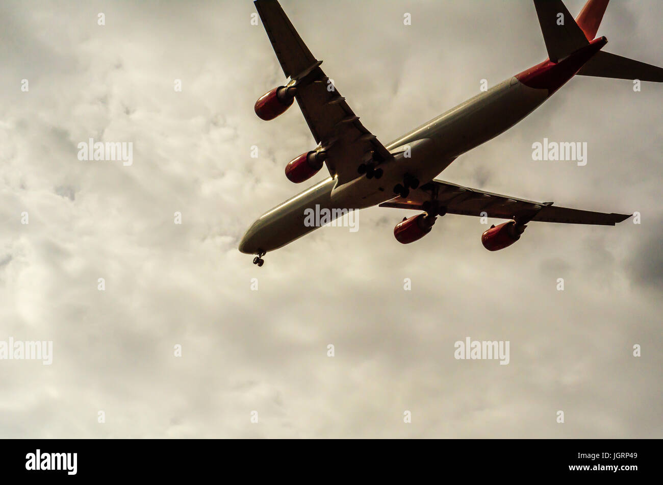 Passenger plane flying in the blue sky with clouds, cruise aircraft ...