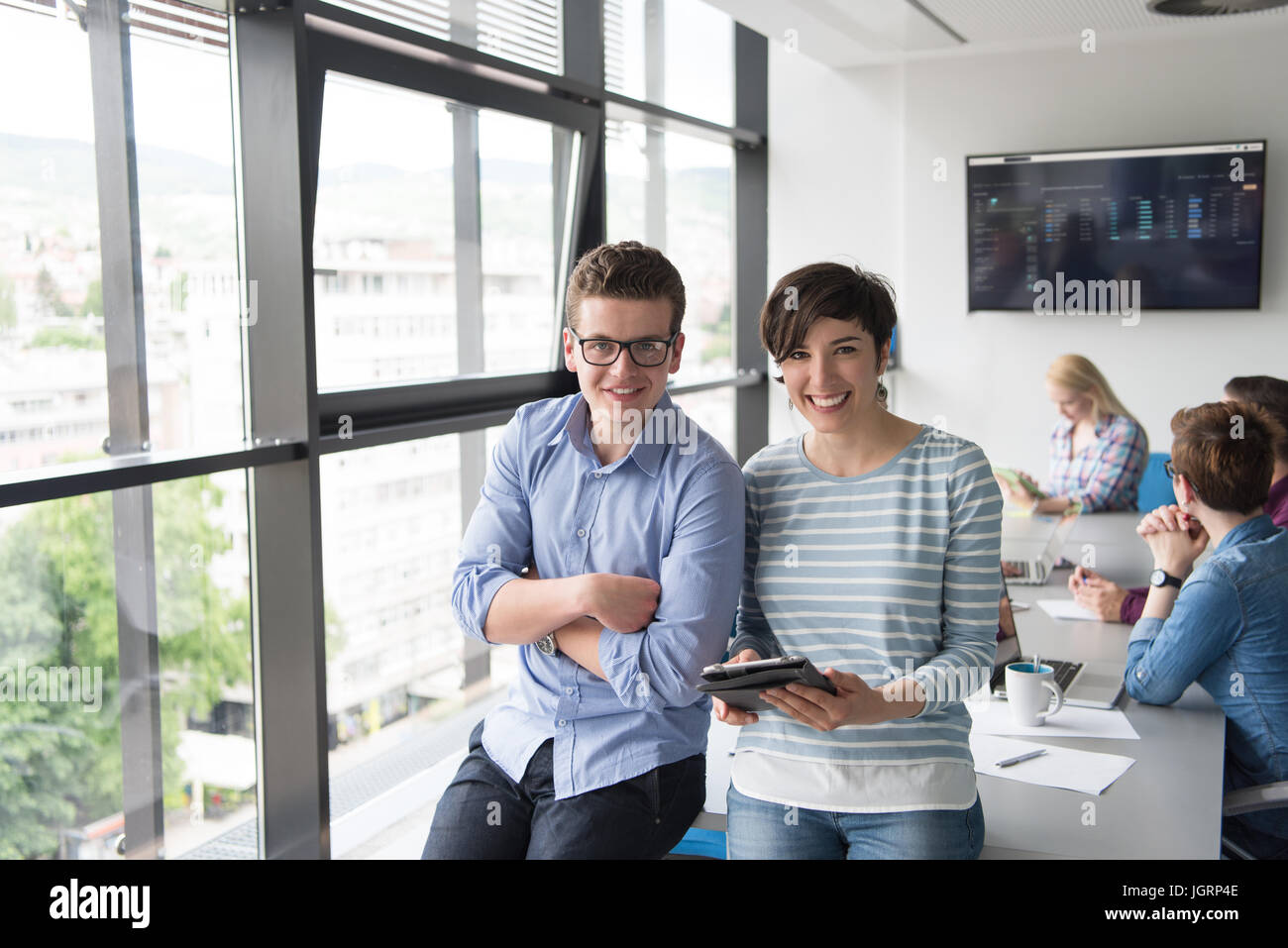 two business people using tablet preparing for next meeting and ...