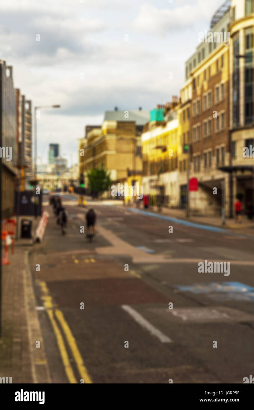 Abstract urban background with blurred buildings and street shallow ...