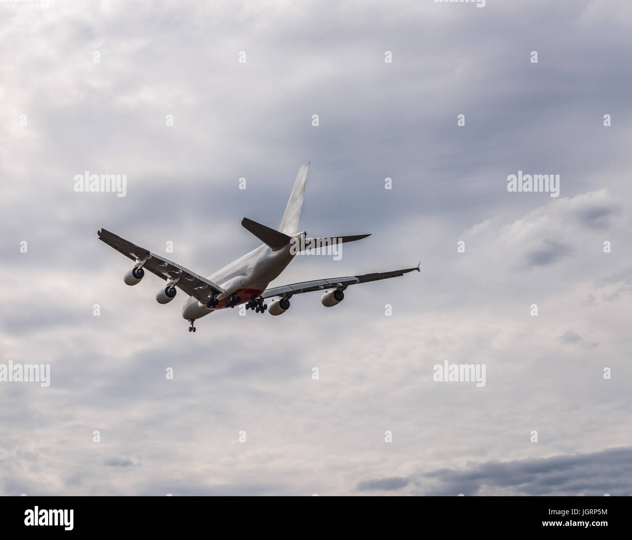 Passenger plane flying in the blue sky with clouds, cruise aircraft ...