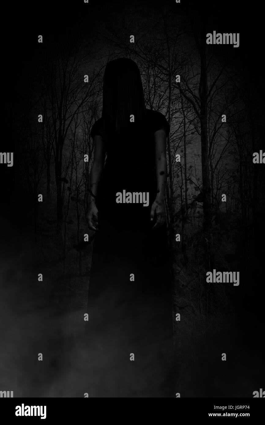 Ghost woman in haunted forest Stock Photo - Alamy