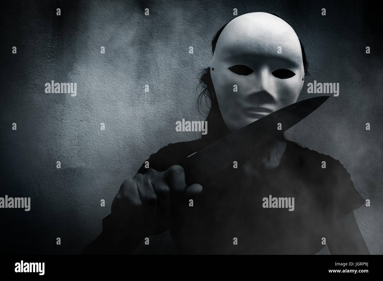Mysterious woman in black wearing white mask with knife,Scary ...