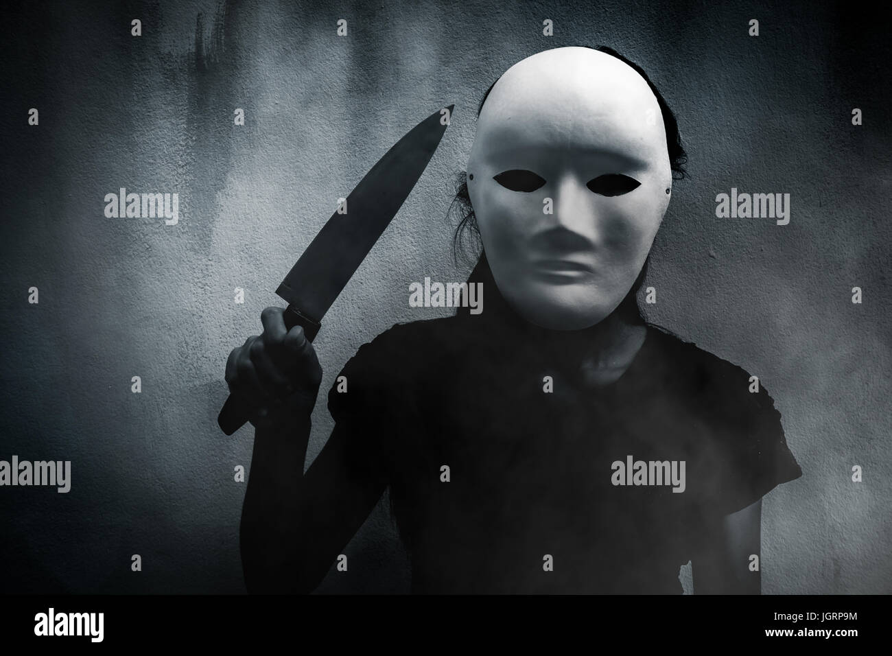 Mysterious woman in black wearing white mask with knife,Scary ...