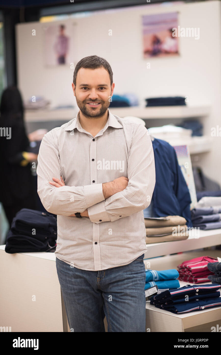 Portrait of an attractive man Shopping In A Man's Clothing Store Stock ...