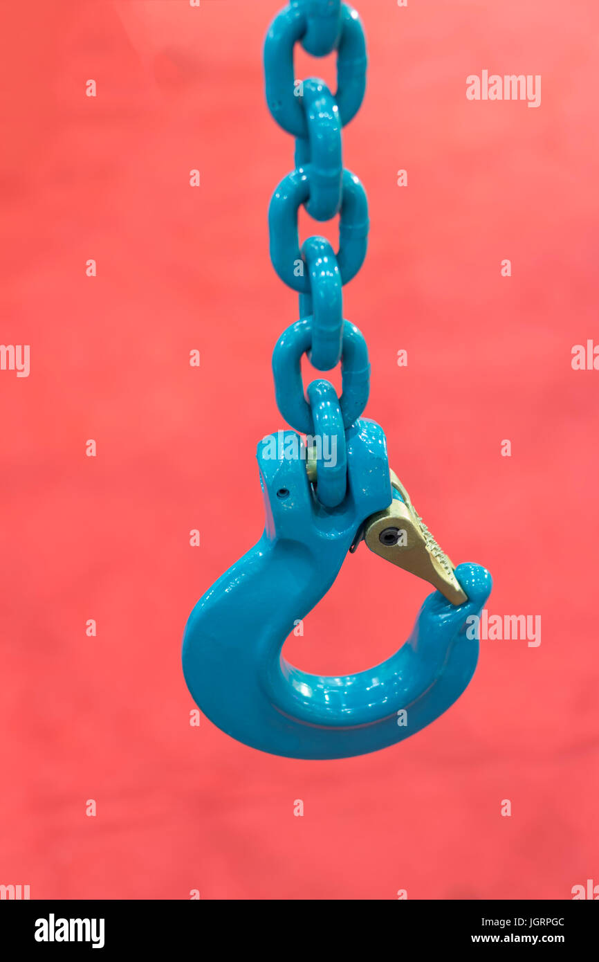 Industrial Blue Steel Chain with hook in red background Stock Photo - Alamy