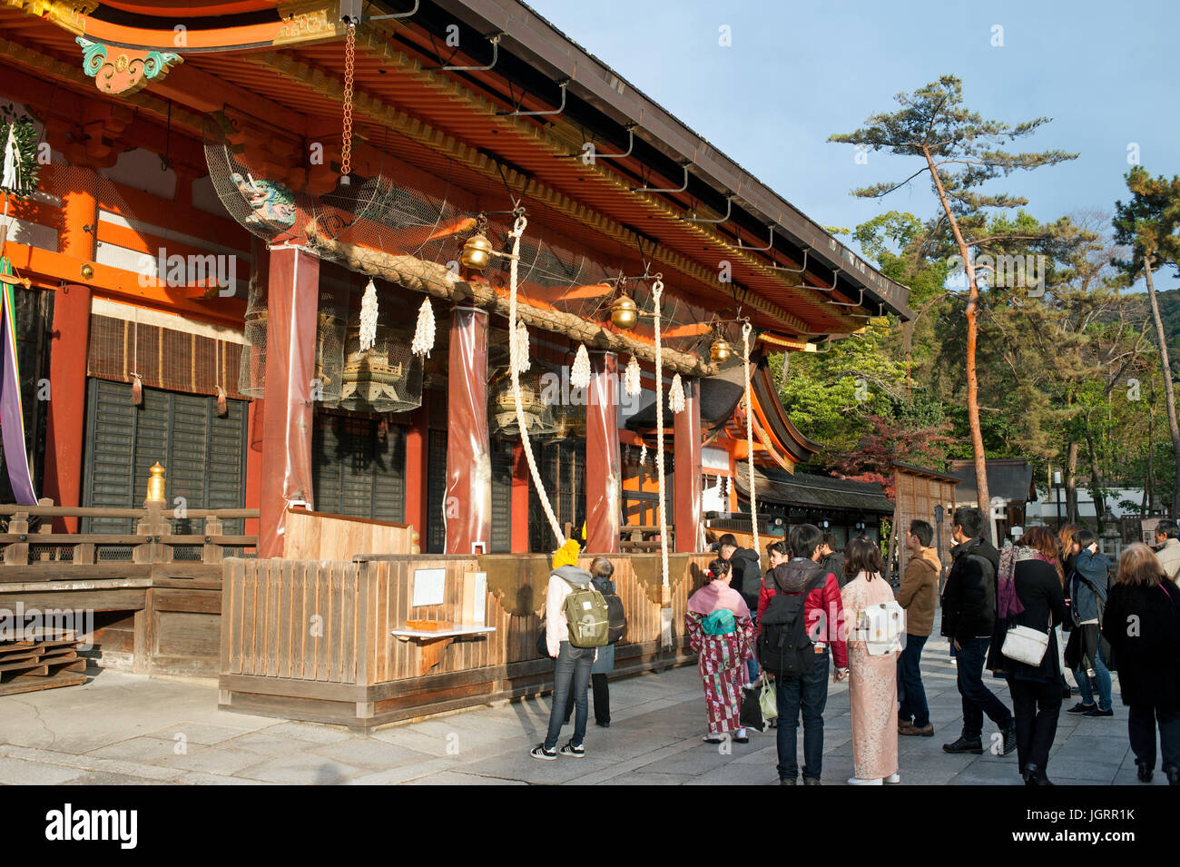 Kyoto, Japan - Japanese people pulling ropes at shrine in Maruyama park ...