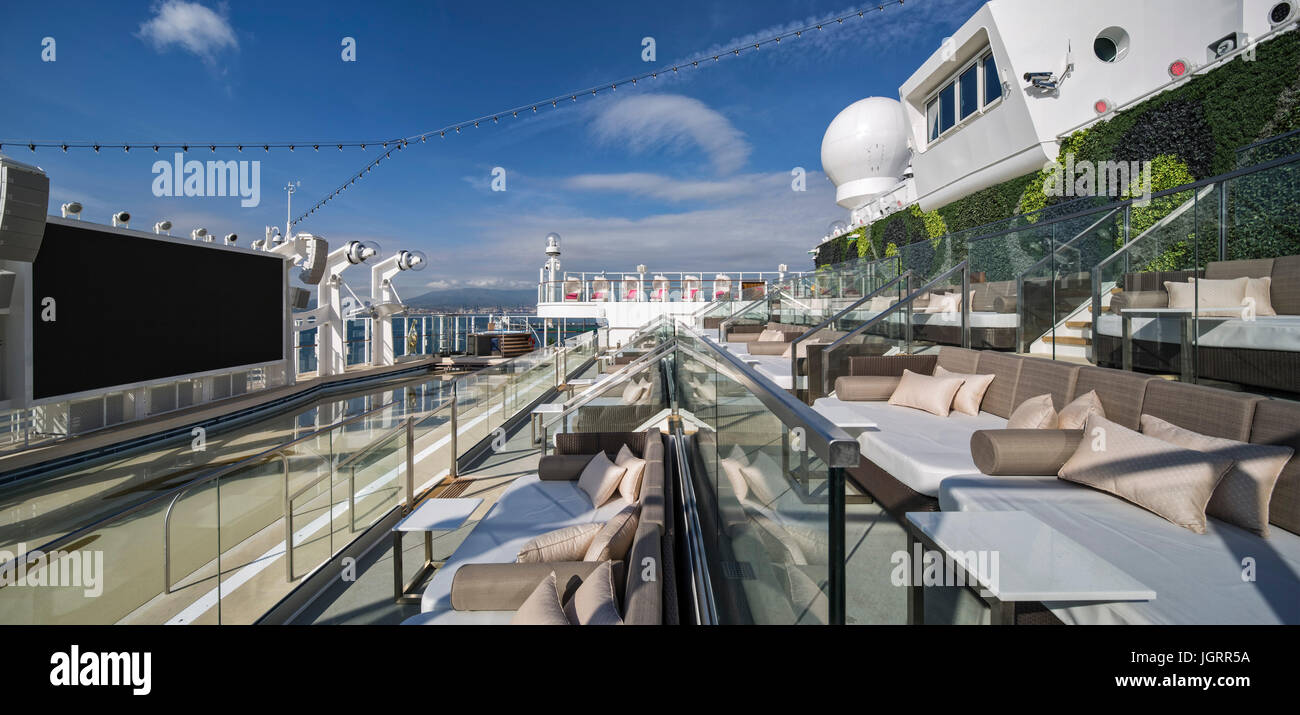 Deck area of the Genting Dream Cruise Ship. Outdoor cinema with pool ...