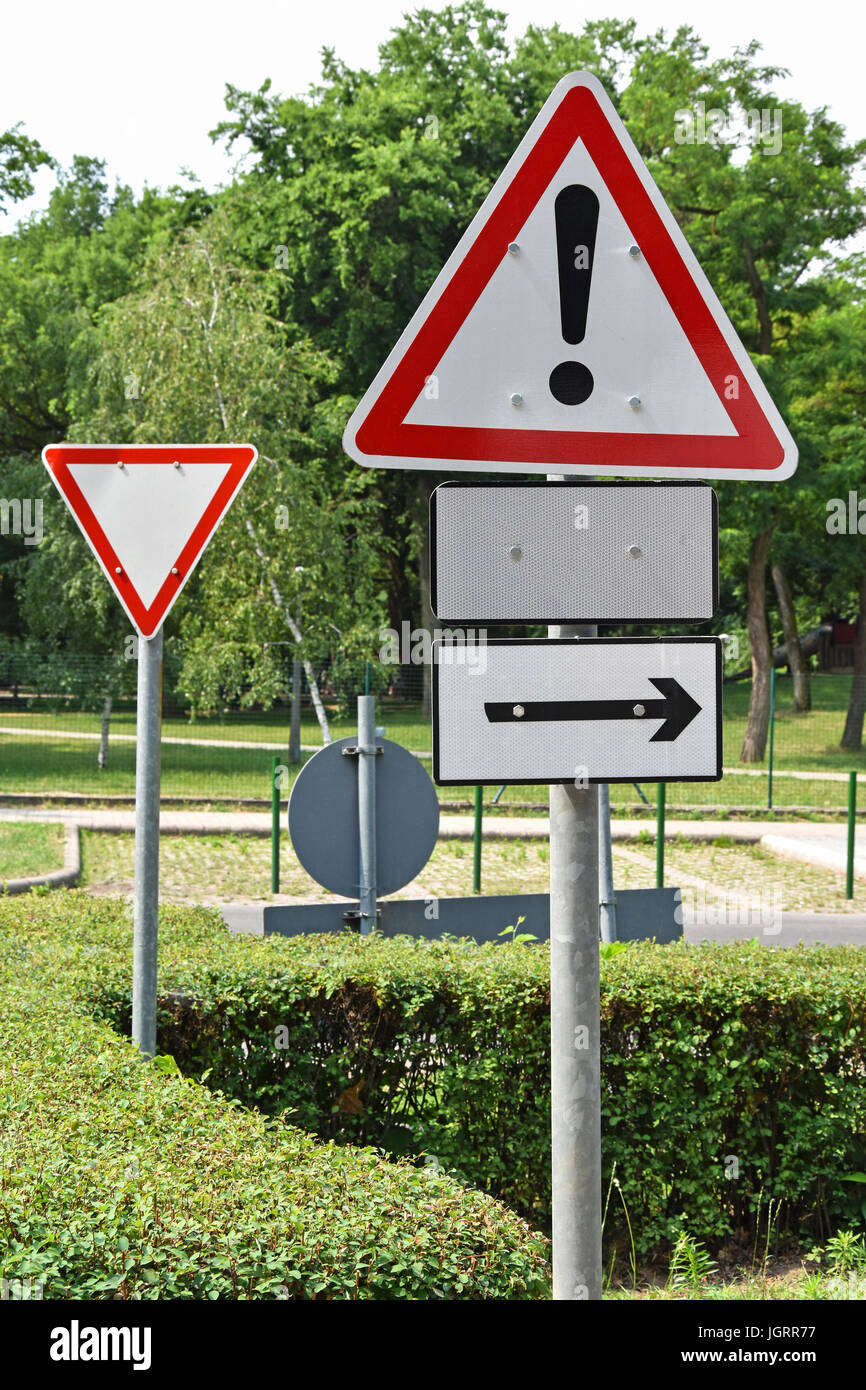 Yield and danger traffic signs Stock Photo - Alamy
