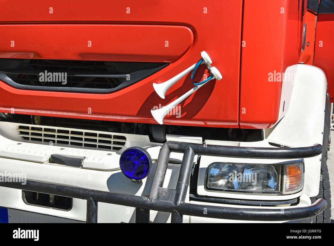 Front side of the fire engine with hornes Stock Photo - Alamy