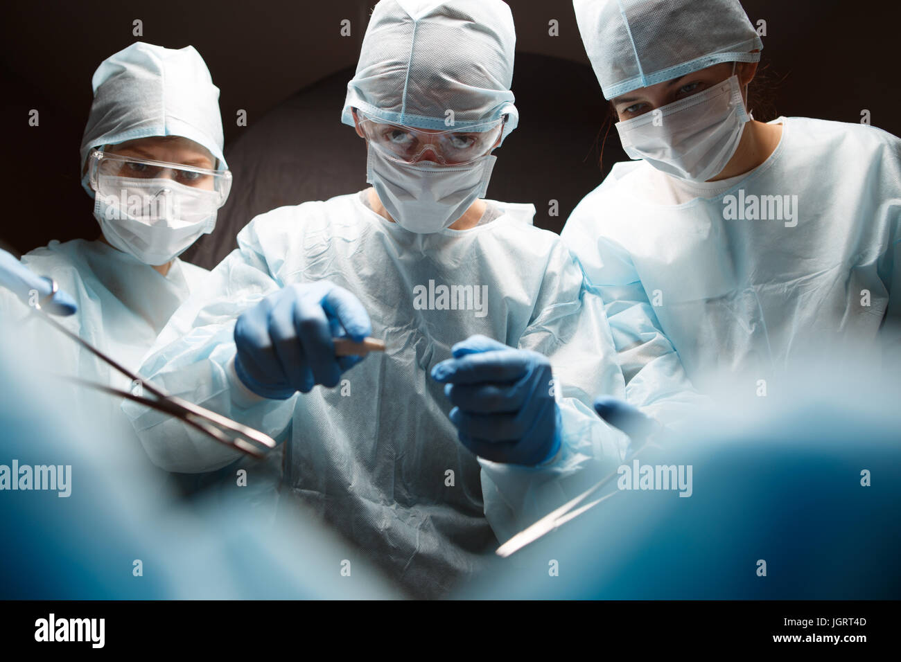 Team professional surgeons operate hi-res stock photography and images ...
