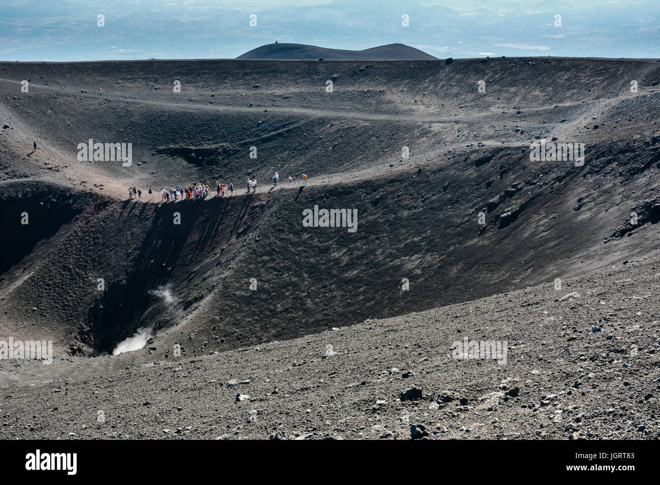 Mount Etna, Sicily, Italy - people walking in volcano in peace period ...