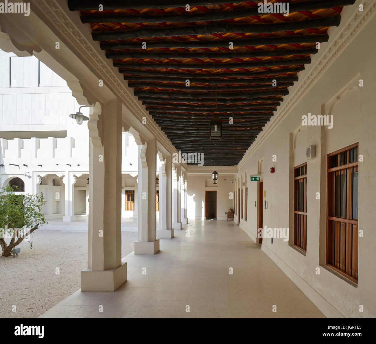 Courtyard corridor. Radwani House, Doha, Qatar. Architect: John McAslan ...