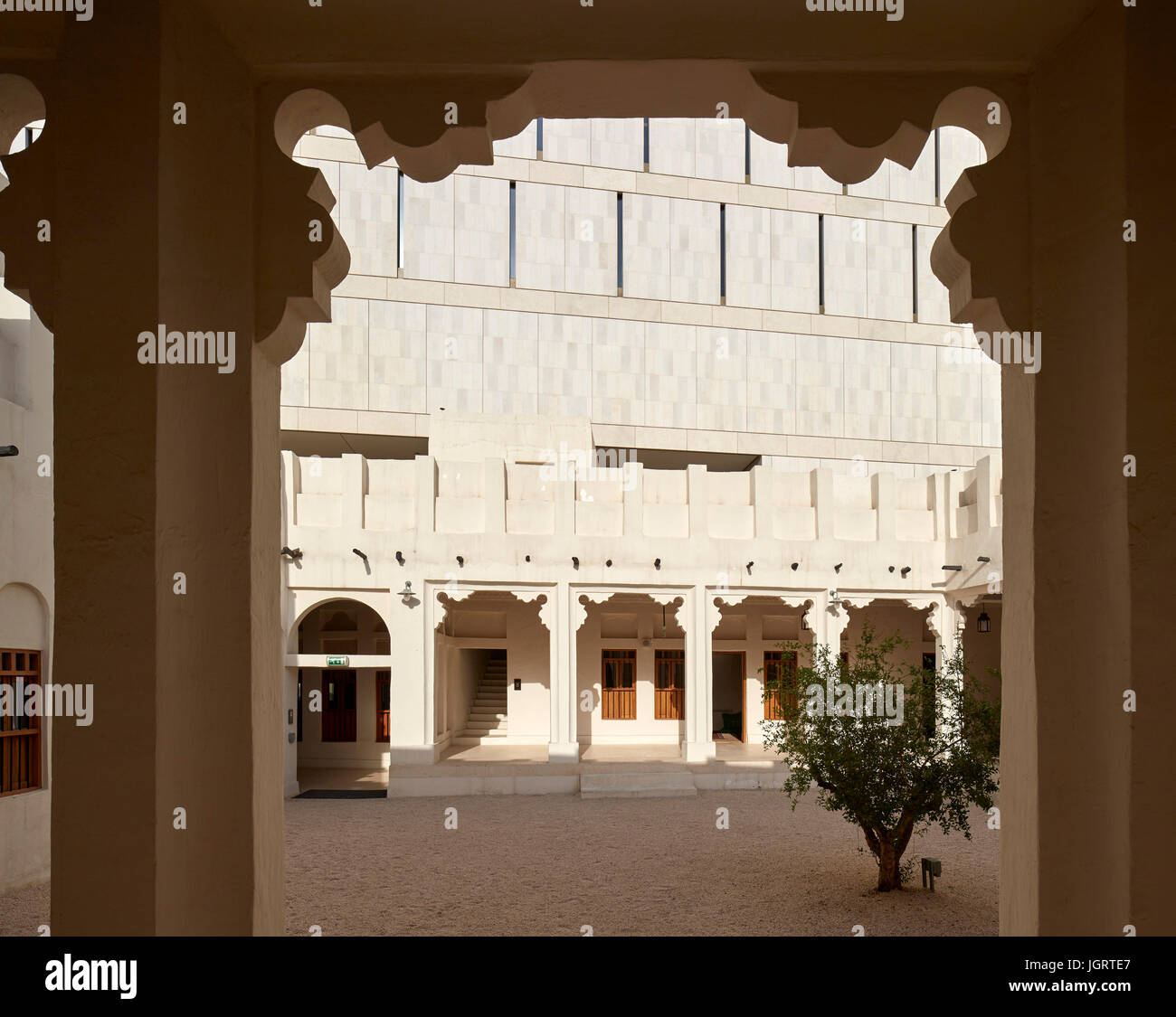 Courtyard corridor. Radwani House, Doha, Qatar. Architect: John McAslan ...