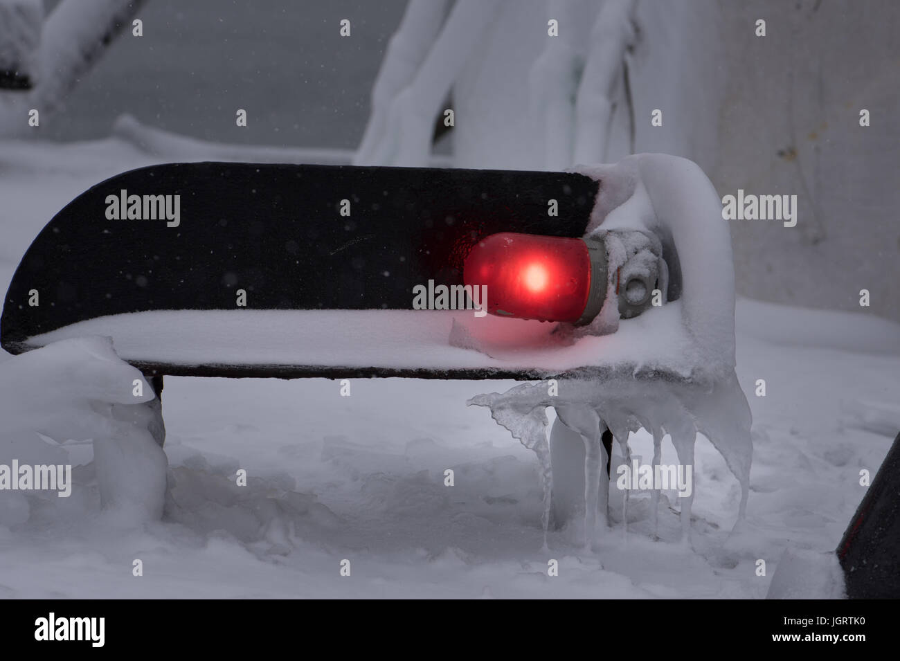 Running light on lobster boat during blizzard Stock Photo - Alamy