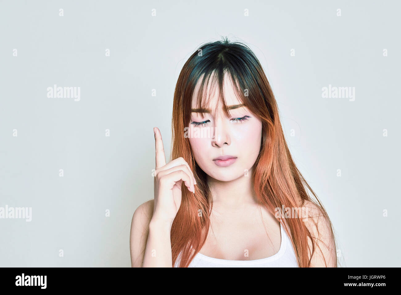 Asian woman is thinking Stock Photo - Alamy