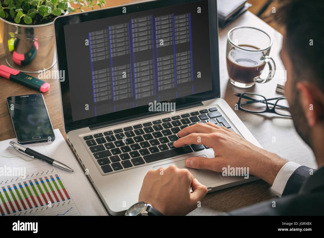 Computer server storage units on a laptop screen - office background ...