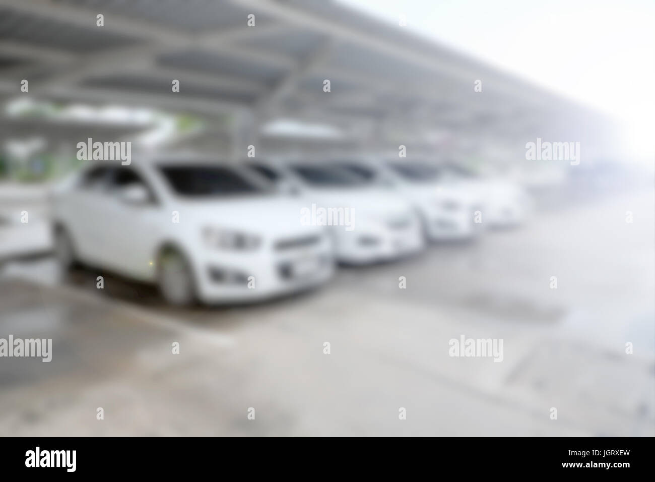 Abstract blur cars parking with bokeh light Background for use as ...