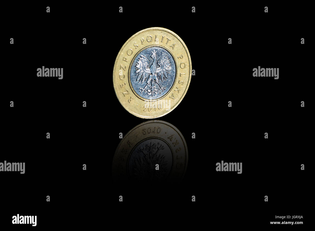 Polish coin 2 zloty on black background with reflection Stock Photo - Alamy