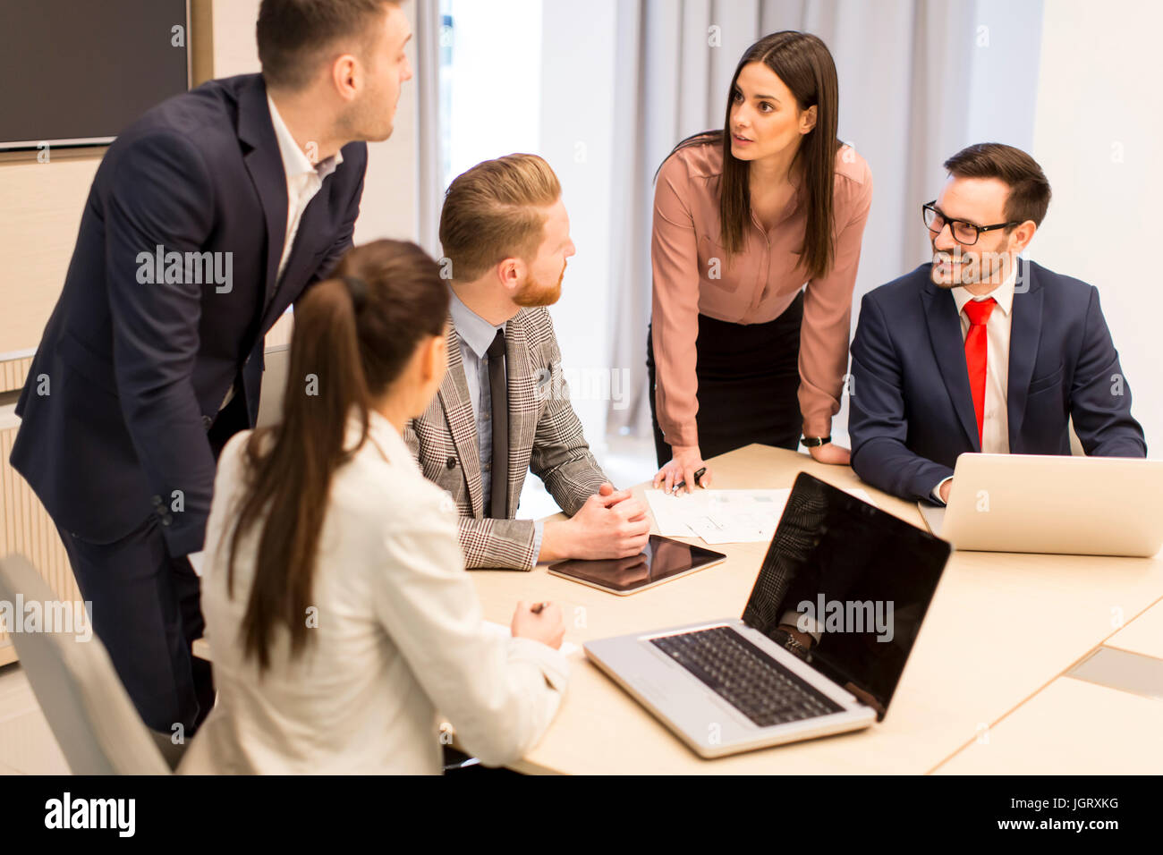 Young people have teamwork by desk in the modern office Stock Photo - Alamy