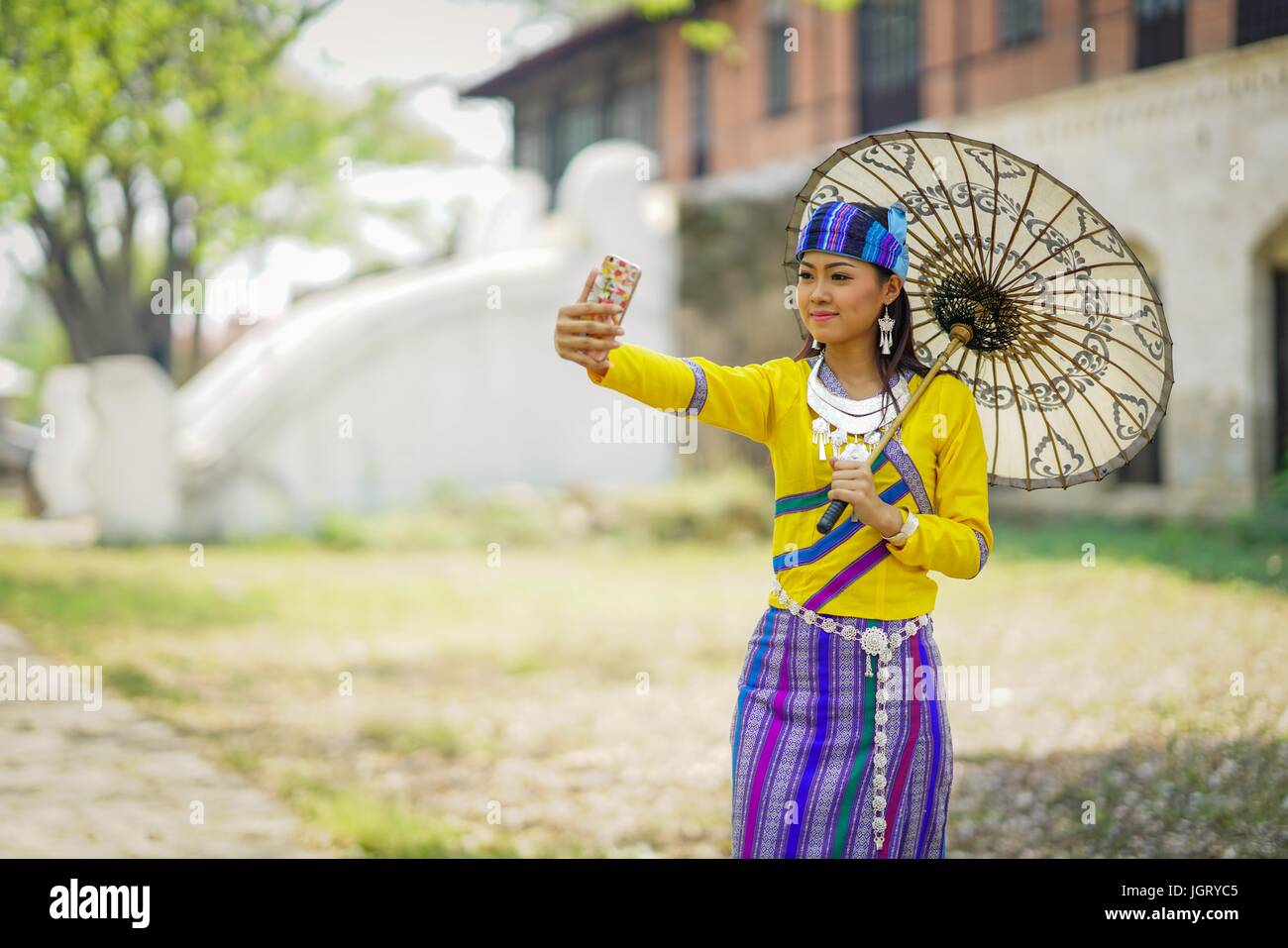 Pretty Shan girl taking selfie infront of an old Palace Stock Photo - Alamy