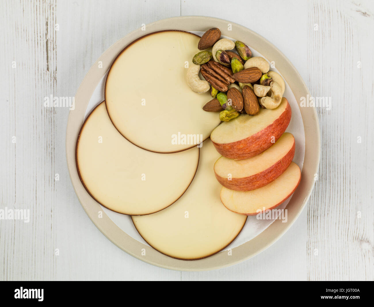 Sliced Apple and Gouda Cheese Rounds Against a White Background Stock ...