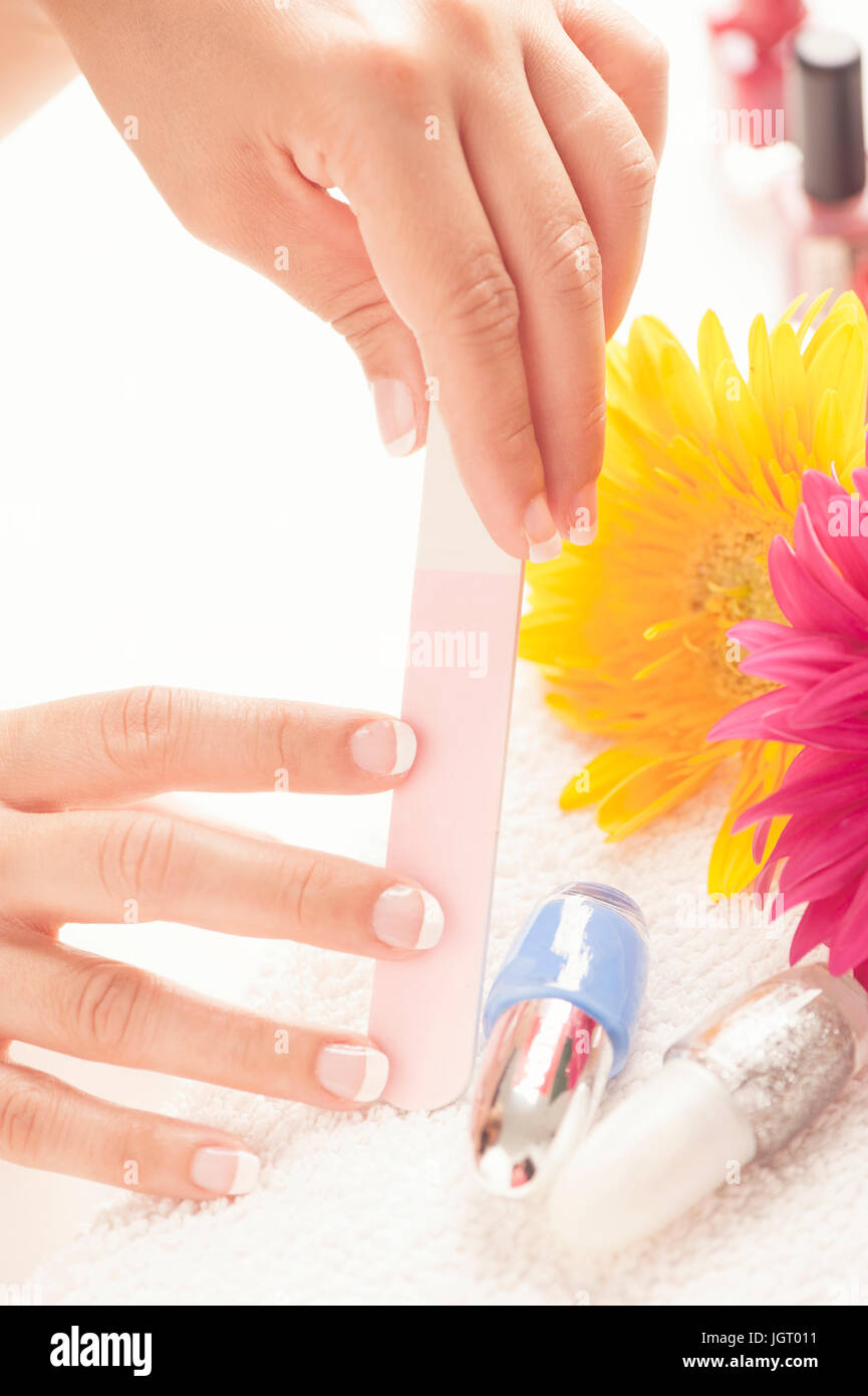 Woman with well manicured nails on white Stock Photo - Alamy