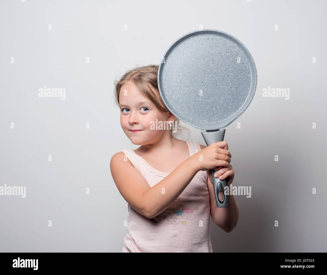 funny girl with a frying pan Stock Photo - Alamy