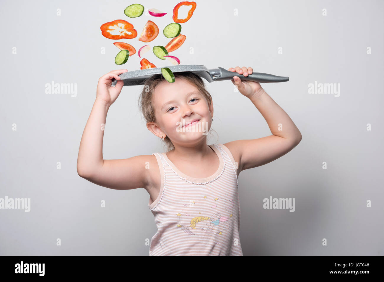 funny girl with a frying pan Stock Photo - Alamy