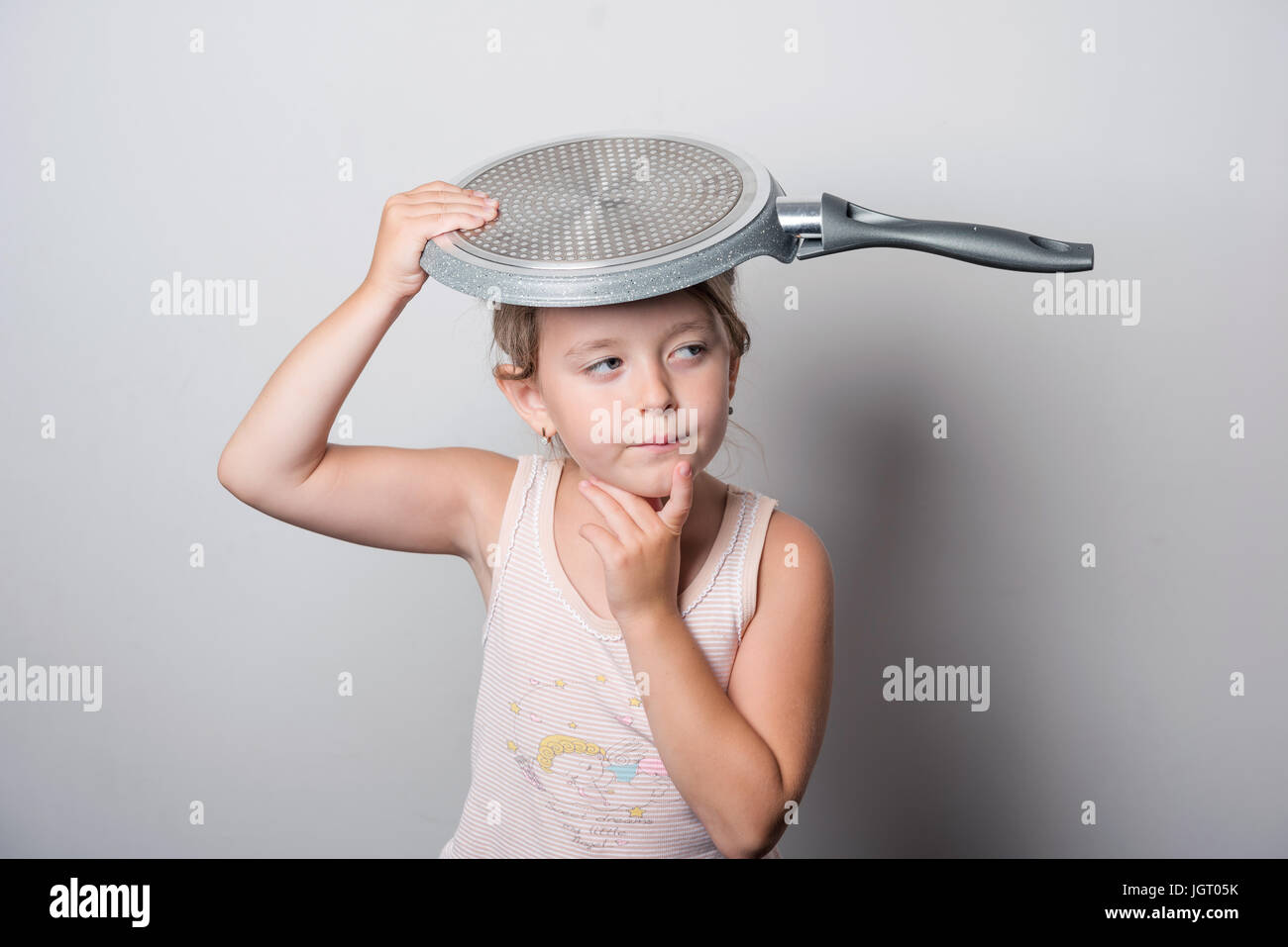 funny girl with a frying pan Stock Photo - Alamy