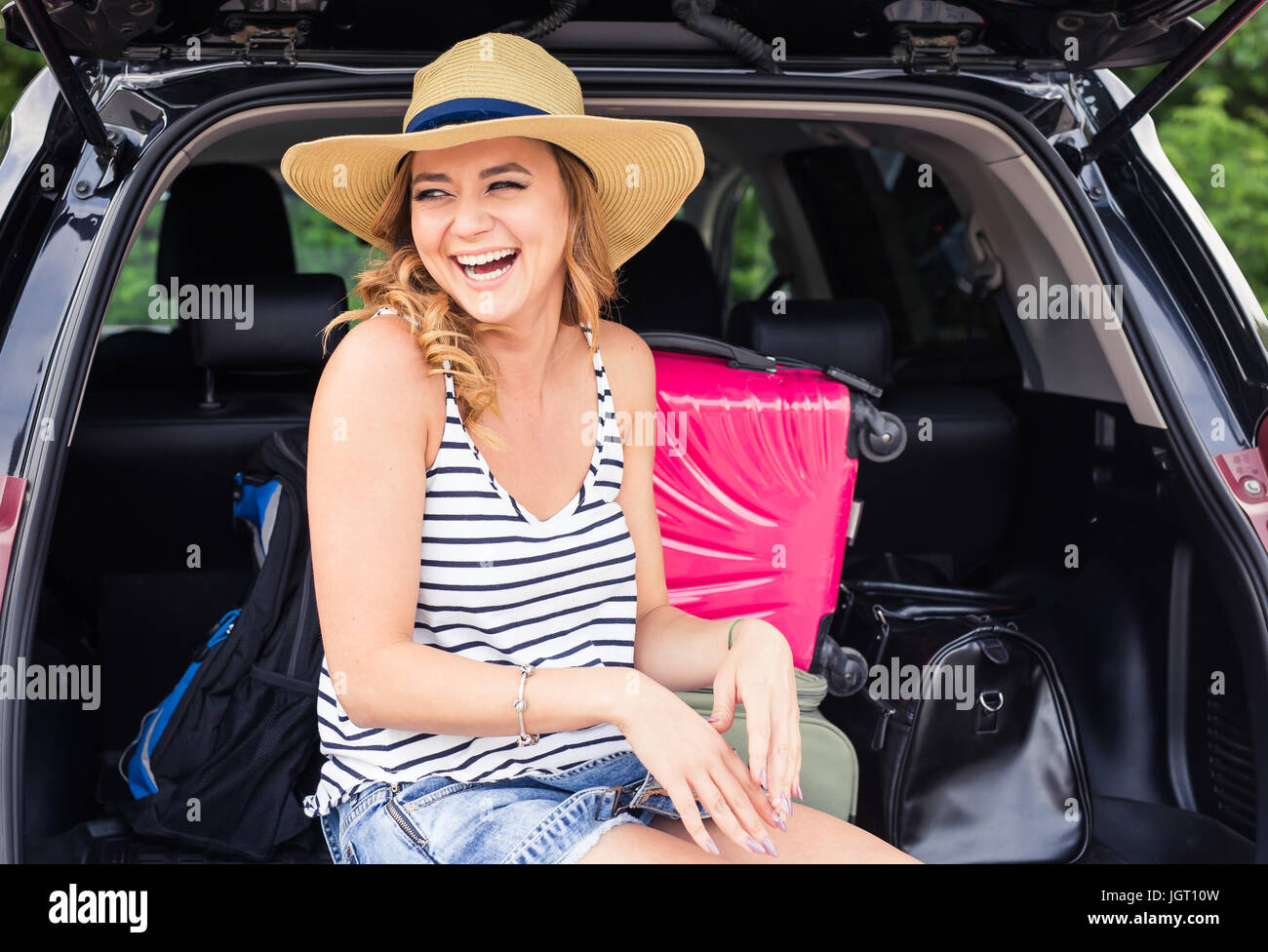 Summer vacation car road trip freedom concept. Happy woman cheering ...