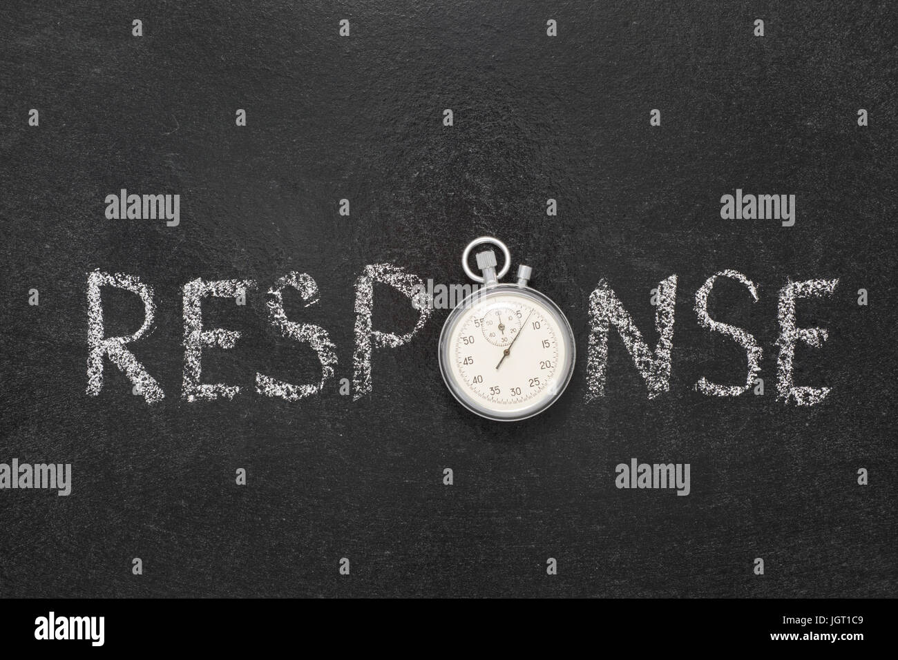 response word handwritten on chalkboard with vintage precise stopwatch ...