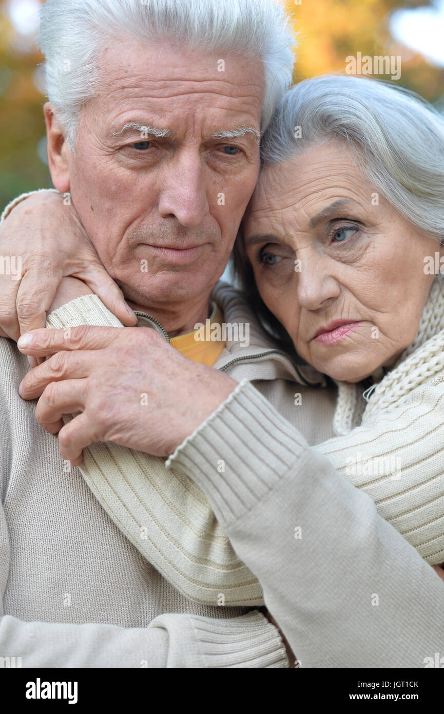 Sad elderly couple in the park Stock Photo - Alamy