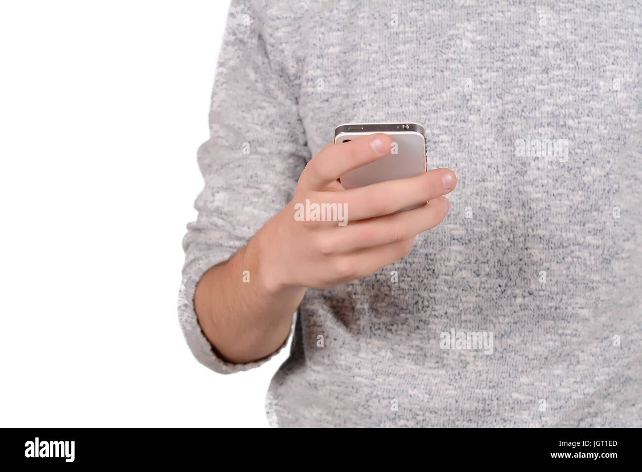 Portrait of a man typing on his smartphone. Isolated white background ...