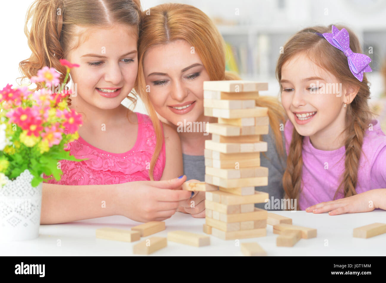 Family playing with blocks together Stock Photo - Alamy