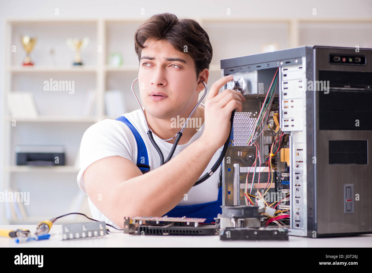 Computer repairman repairing desktop computer Stock Photo - Alamy