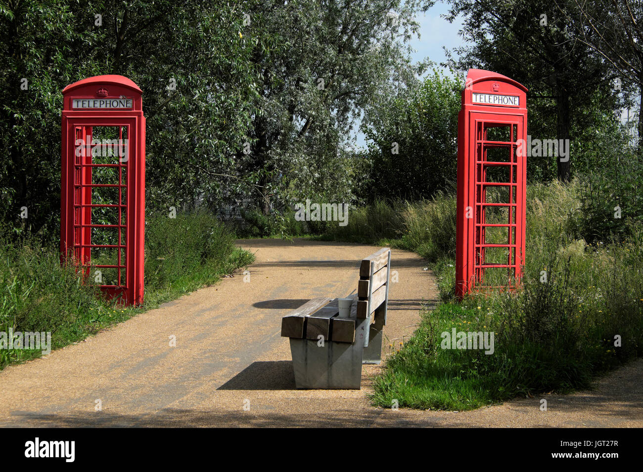 Red telephone box art installation split in half on either side of a ...