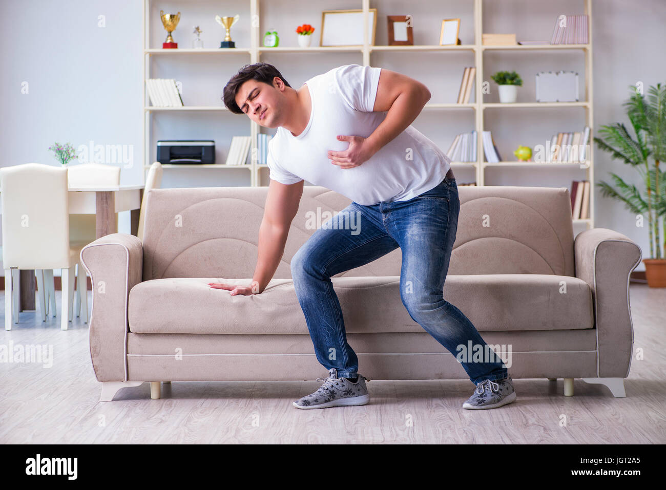 Man suffering from sick stomach and vomiting Stock Photo - Alamy