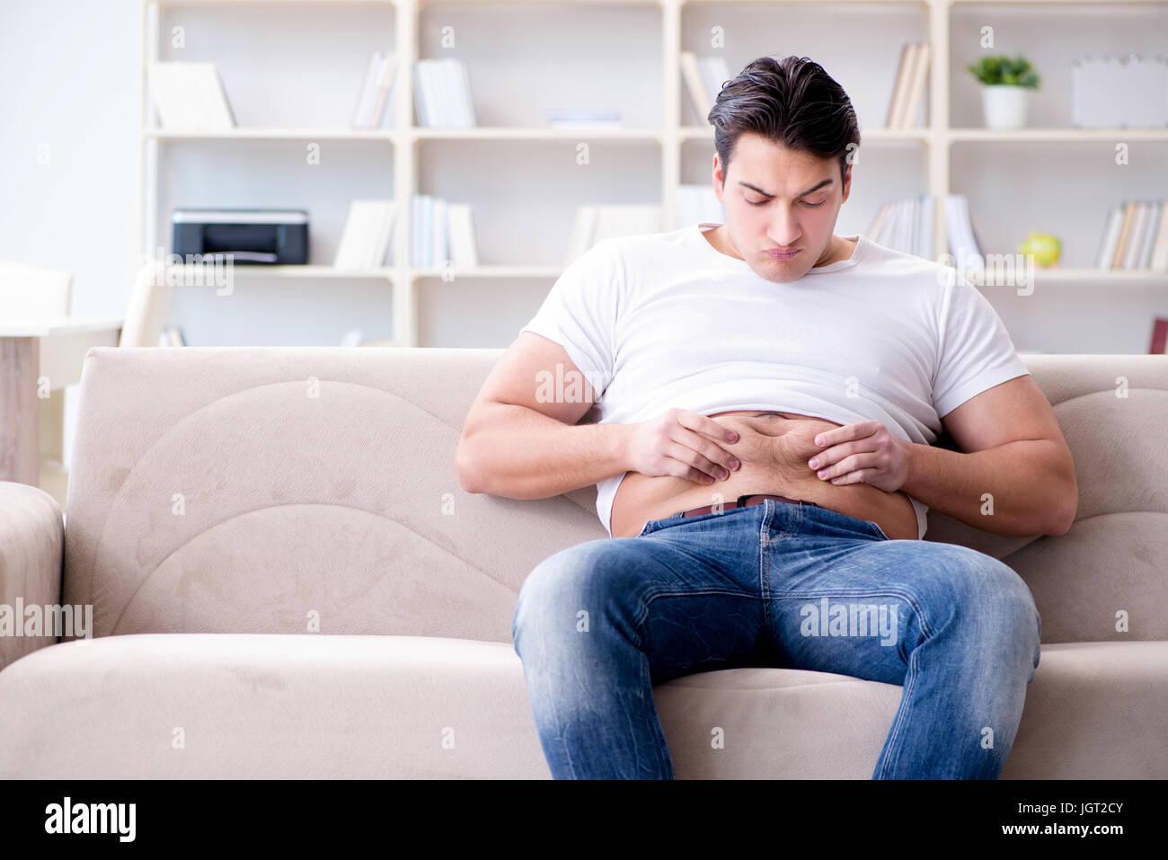 Man suffering from extra weight in diet concept Stock Photo - Alamy