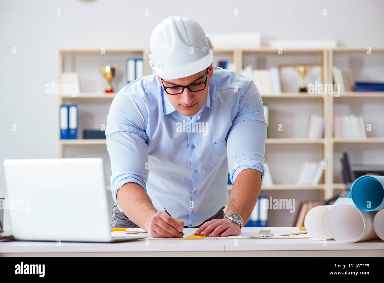 Male engineer working on drawings and blueprints Stock Photo - Alamy