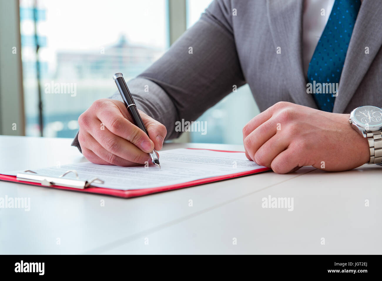 Businessman taking notes at the meeting Stock Photo - Alamy