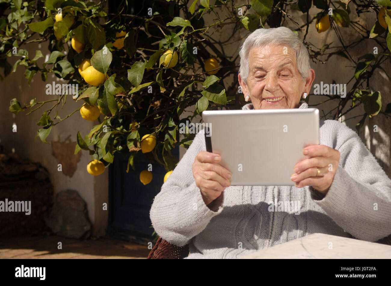 old woman with tablet Stock Photo - Alamy
