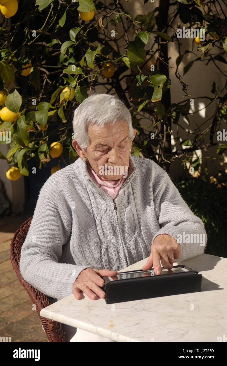old woman with tablet Stock Photo - Alamy