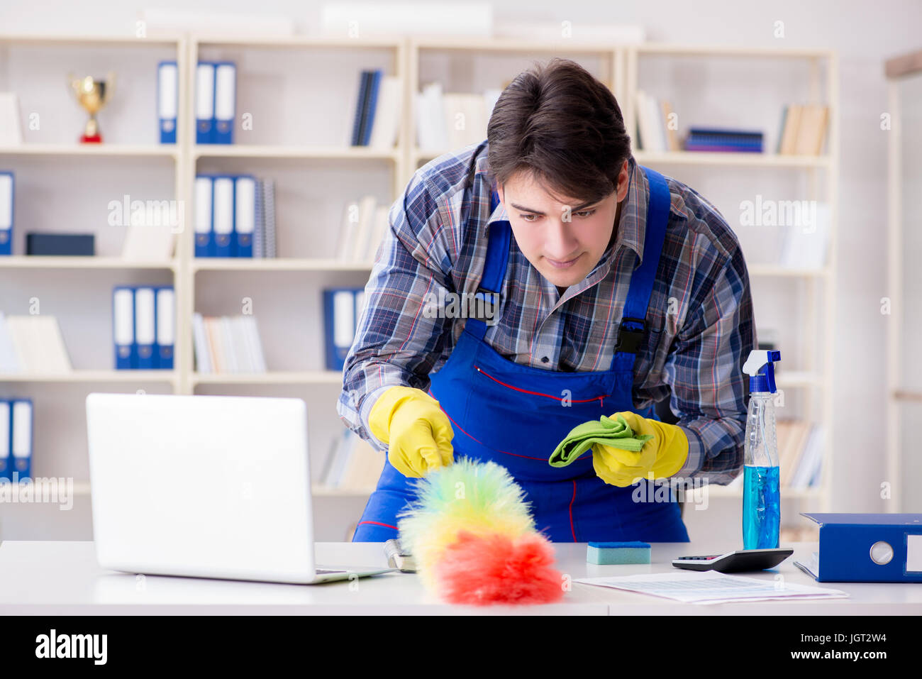 Male cleaner working in the office Stock Photo - Alamy