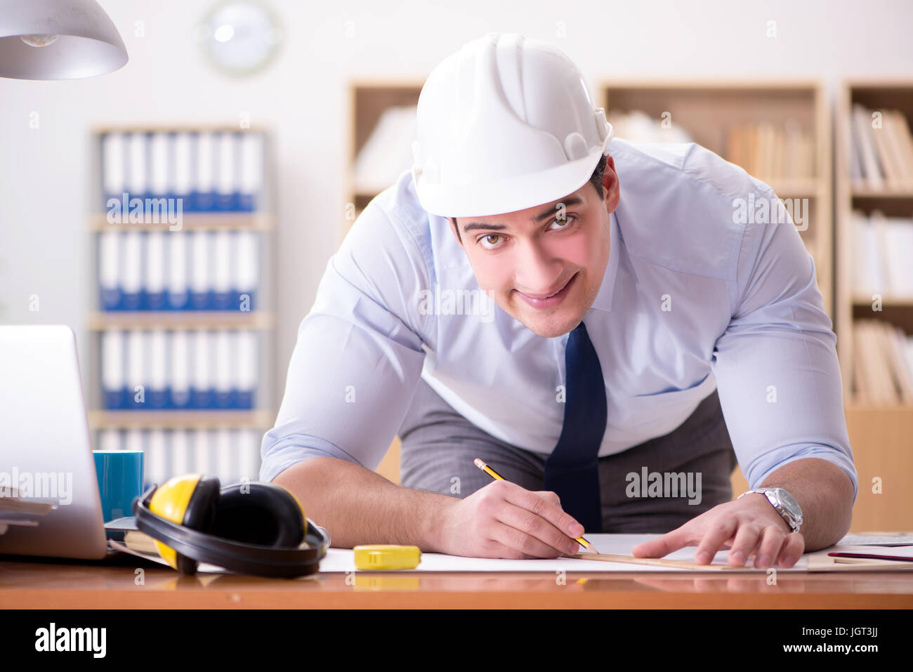 Engineer supervisor working on drawings in the office Stock Photo - Alamy