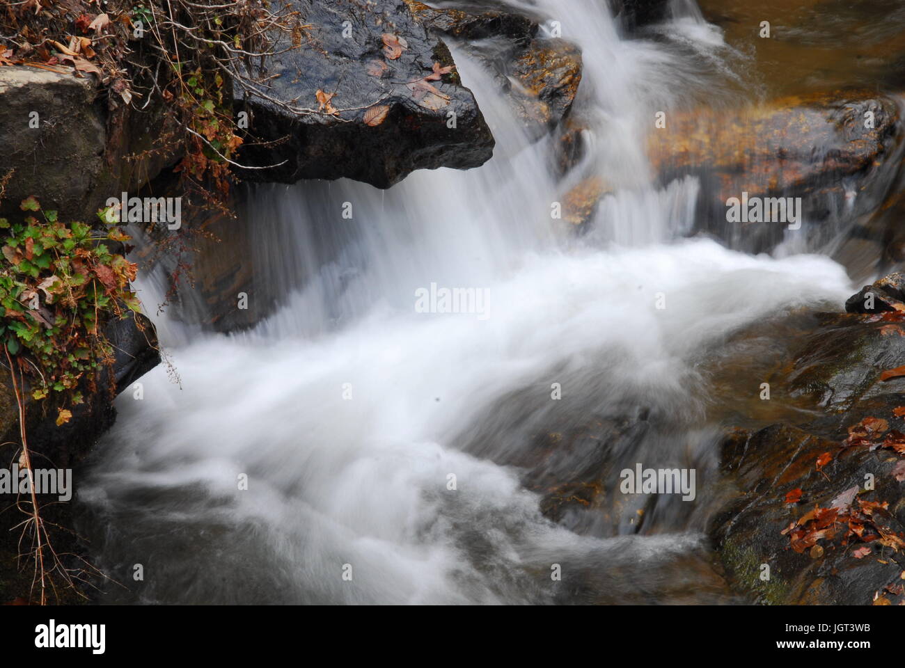 water flowing thru rocks in the mountains Stock Photo - Alamy