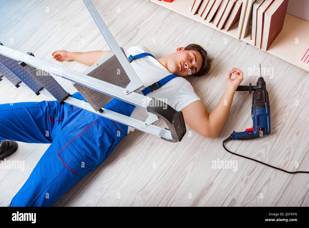 Unsafe behavior concept with falling worker Stock Photo - Alamy